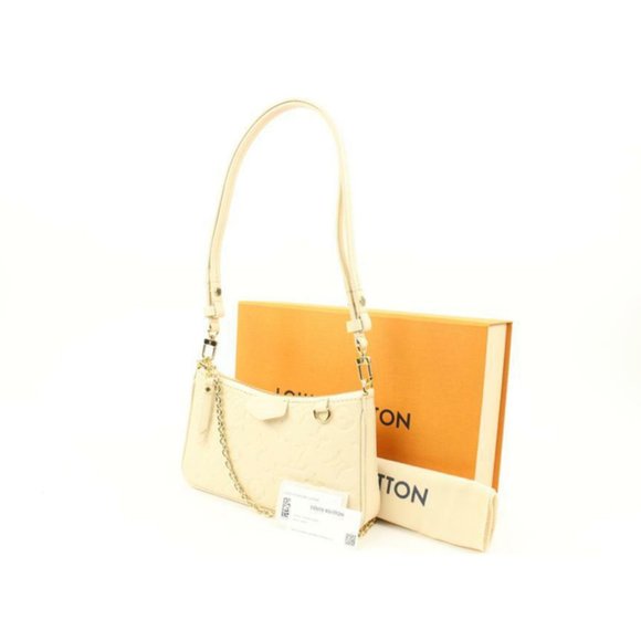 Louis Vuitton | Bags | Louis Vuitton Cream Monogram Empreinte Easy ...